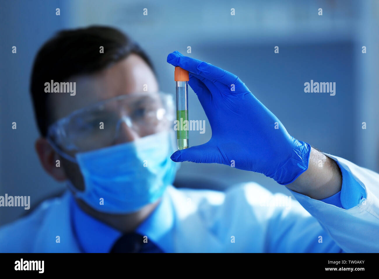 Man holding test tube hi-res stock photography and images - Alamy