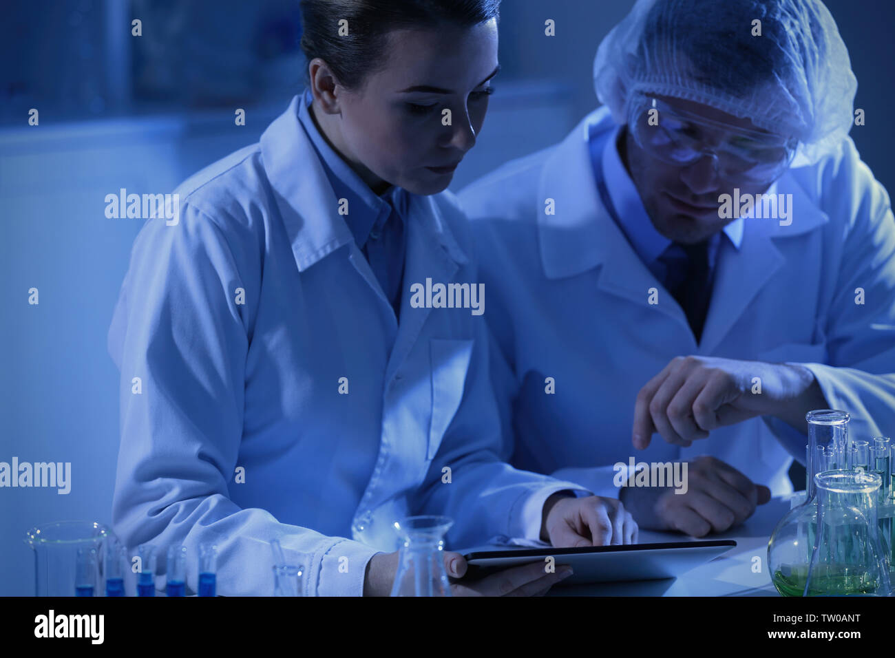 Scientists working in a laboratory Stock Photo - Alamy