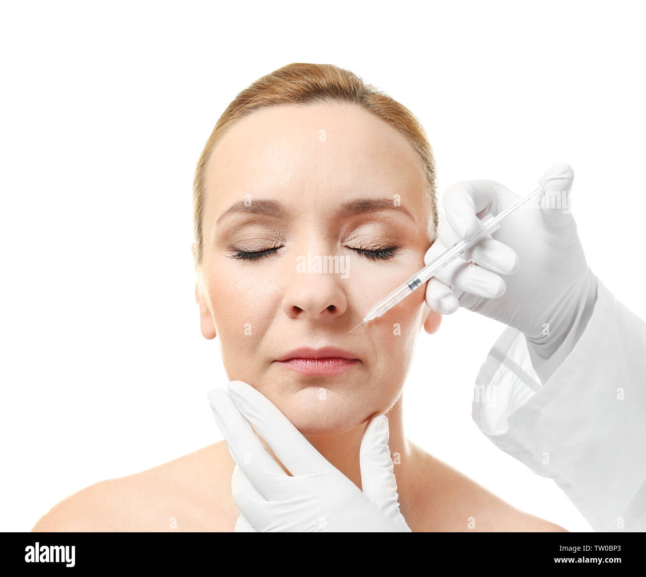 Plastic surgery concept. Mature woman receiving injection on white ...