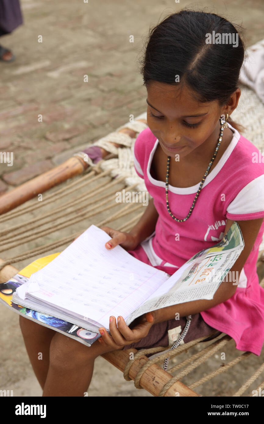 Girl reading a book, India Stock Photo - Alamy