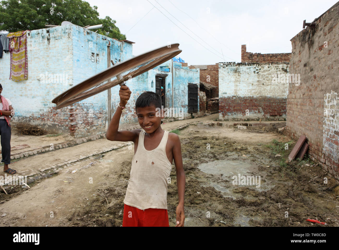 Boy playing tyre tire hi-res stock photography and images - Alamy