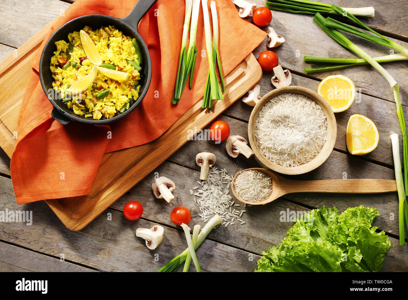 Frying pan with traditional vegetable rice on table Stock Photo - Alamy