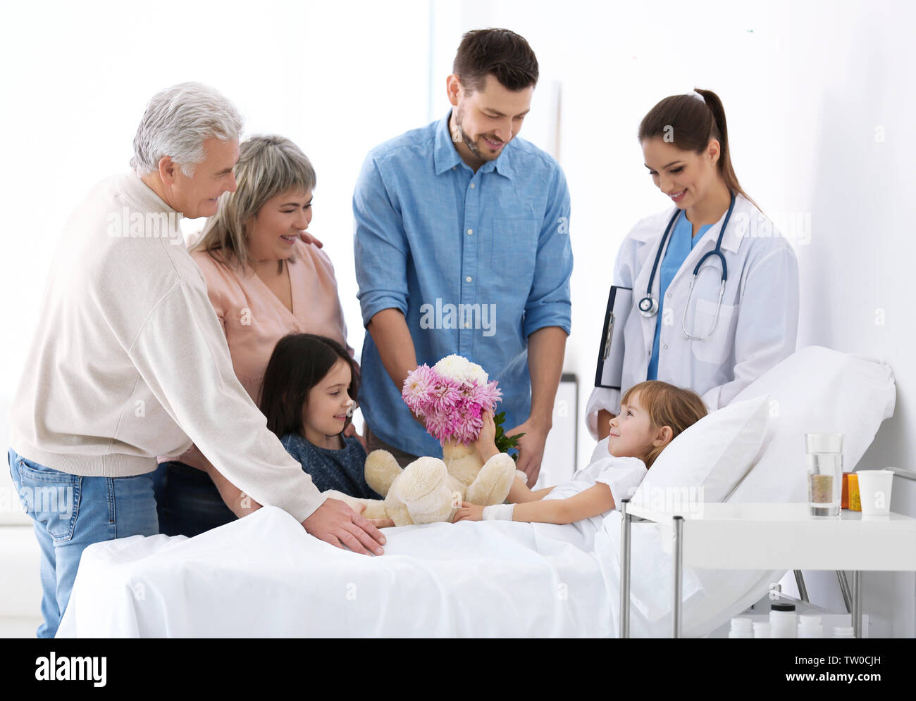 Family visiting little girl in hospital Stock Photo - Alamy