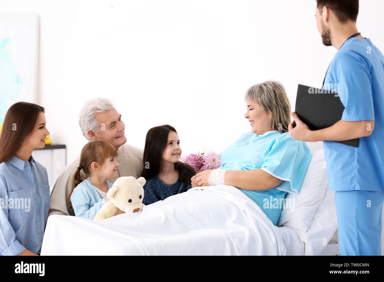 Family visiting grandmother in hospital Stock Photo - Alamy