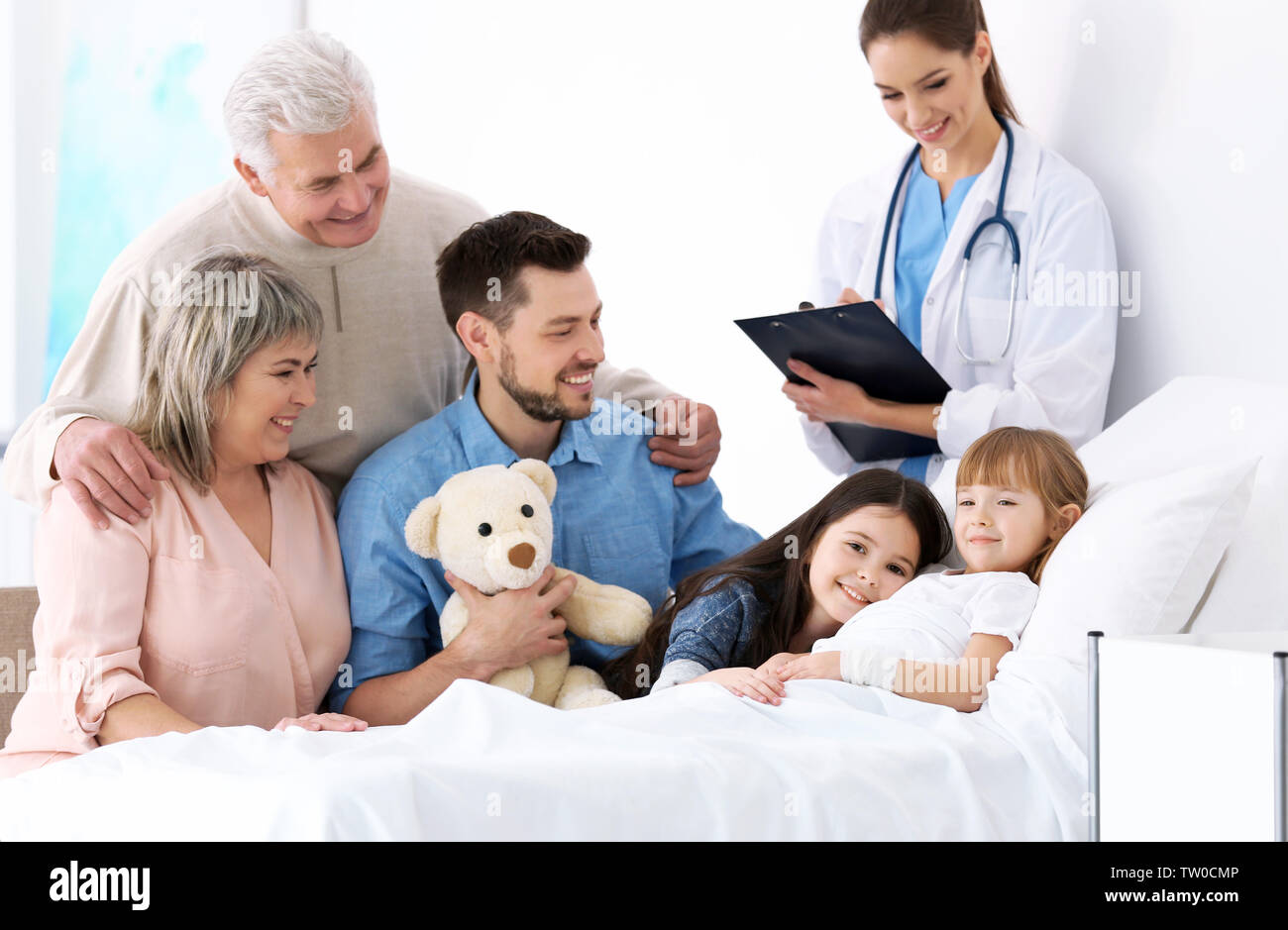Family visiting little girl in hospital Stock Photo - Alamy