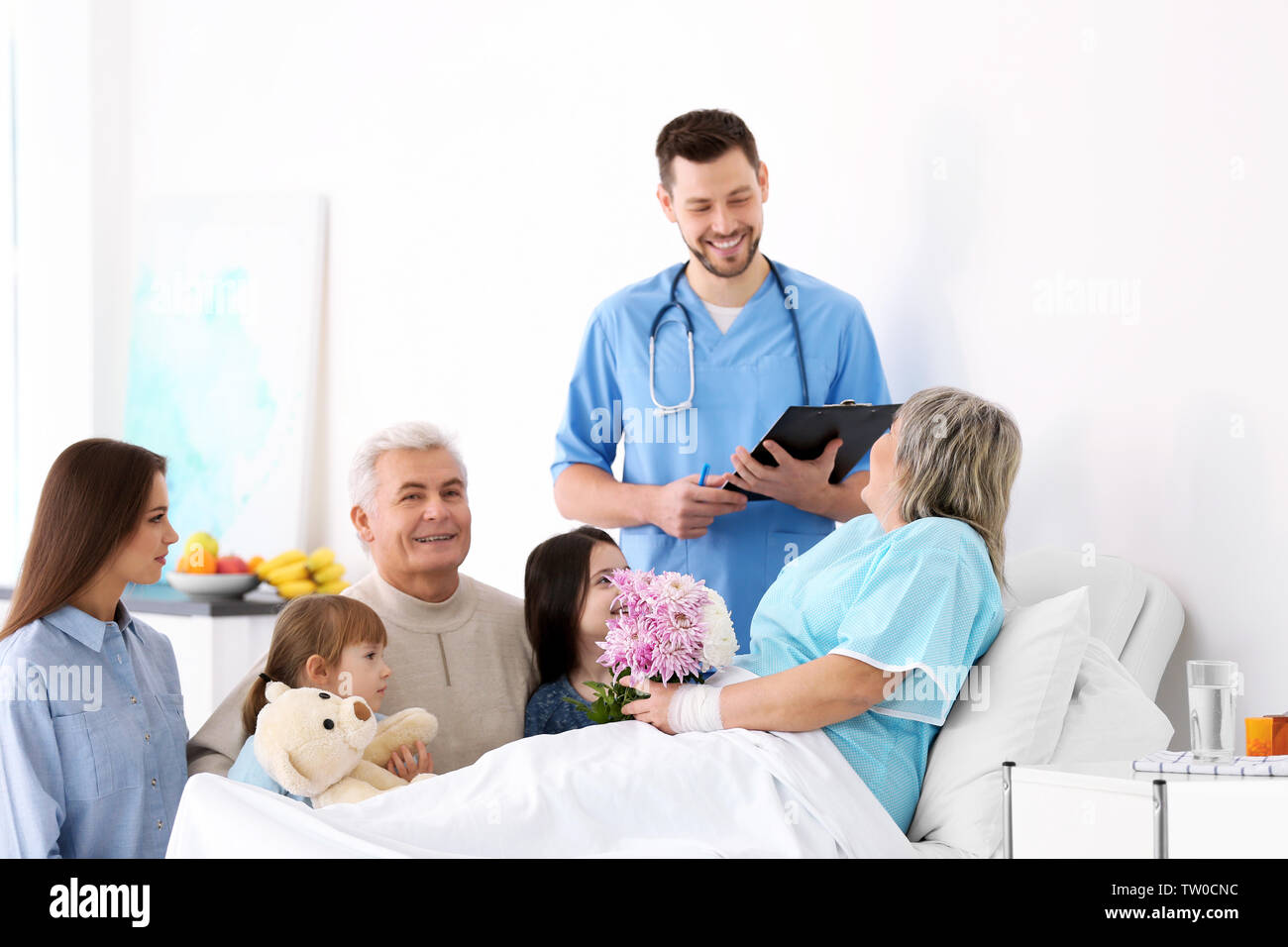 Family visiting grandmother in hospital Stock Photo - Alamy