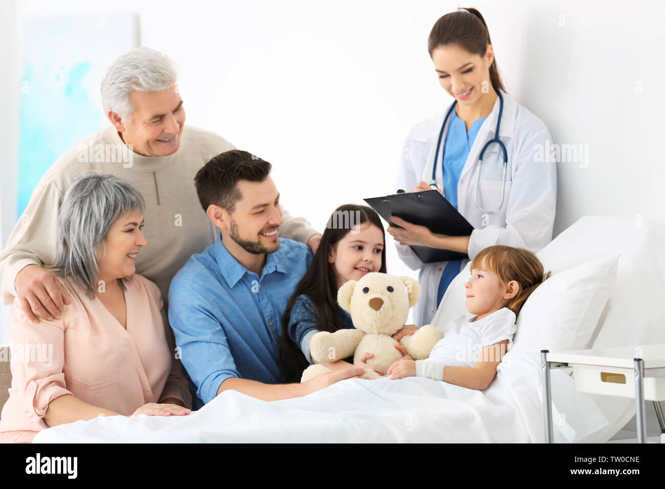 Family visiting little girl in hospital Stock Photo - Alamy