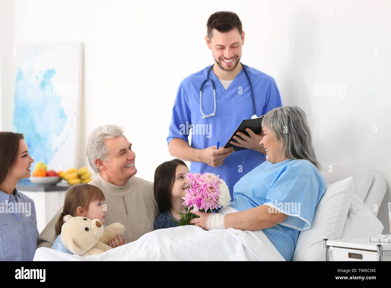 Family visiting grandmother hi-res stock photography and images - Alamy