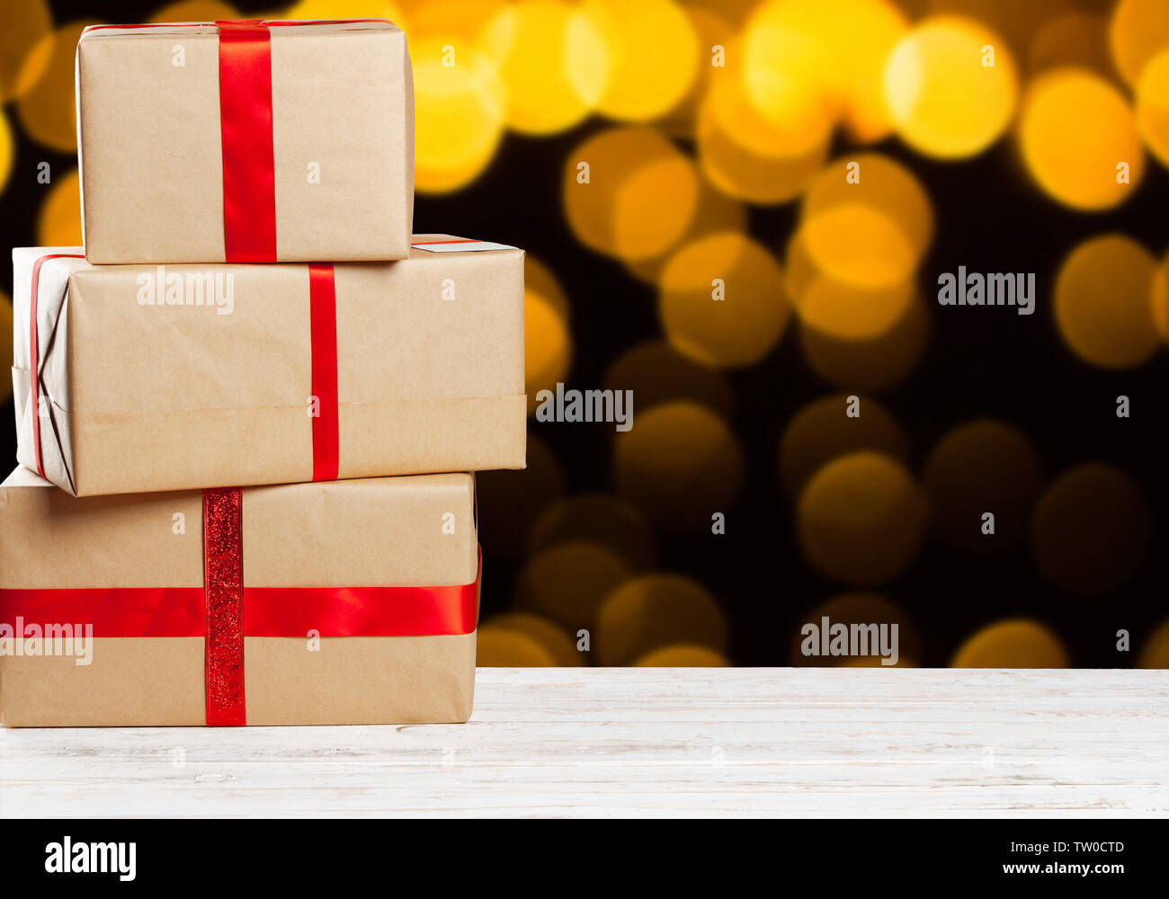 pile of gifts on the old table Stock Photo - Alamy