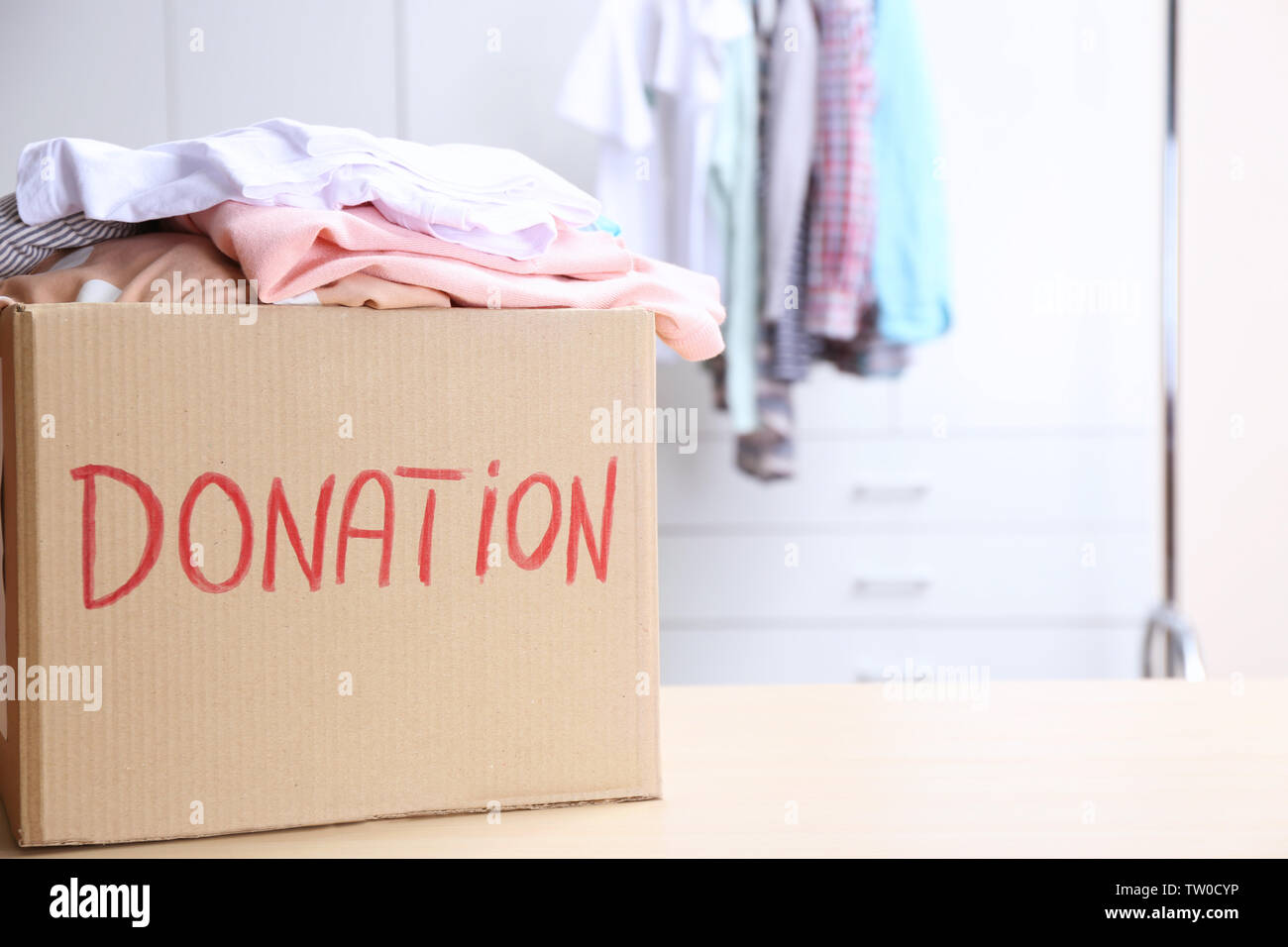 Donation box clothes on wooden hi-res stock photography and images - Alamy