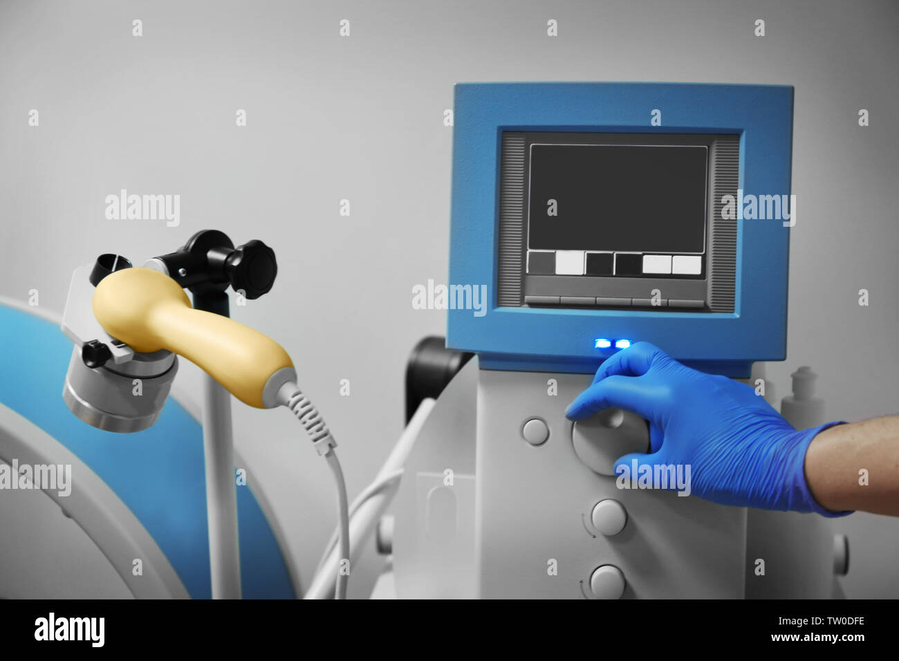 Hand of doctor adjusting ultrasound machine in clinic Stock Photo - Alamy