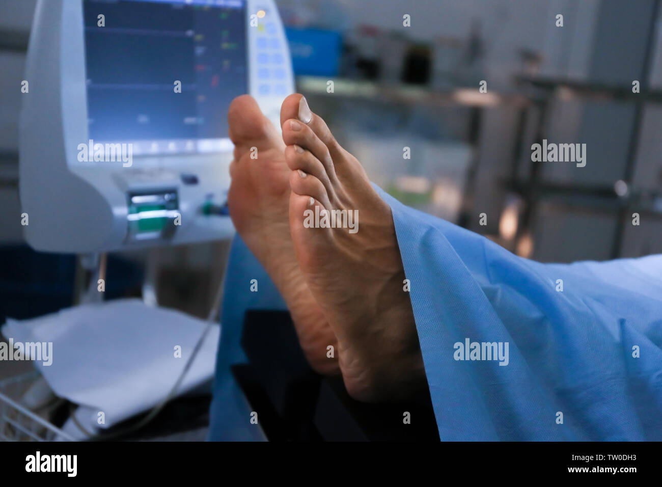 Feet of patient in operating room Stock Photo - Alamy