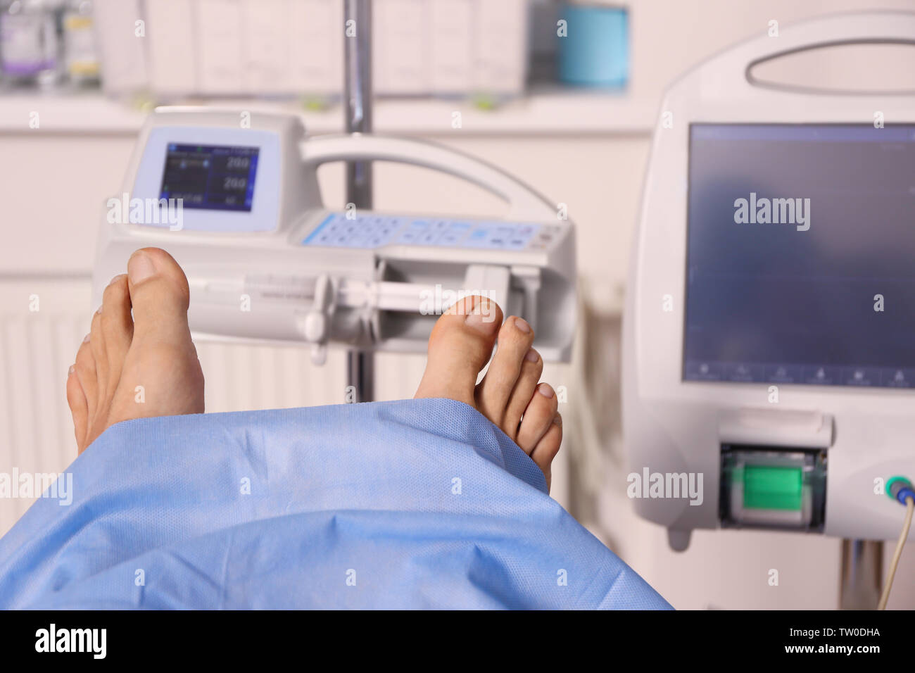 Feet of patient in operating room Stock Photo - Alamy
