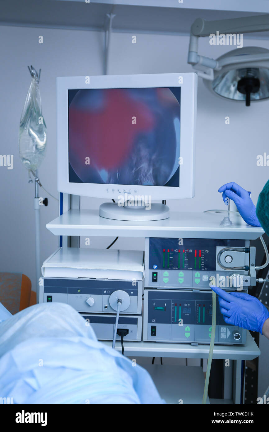 Doctor adjusting special equipment hi-res stock photography and images ...