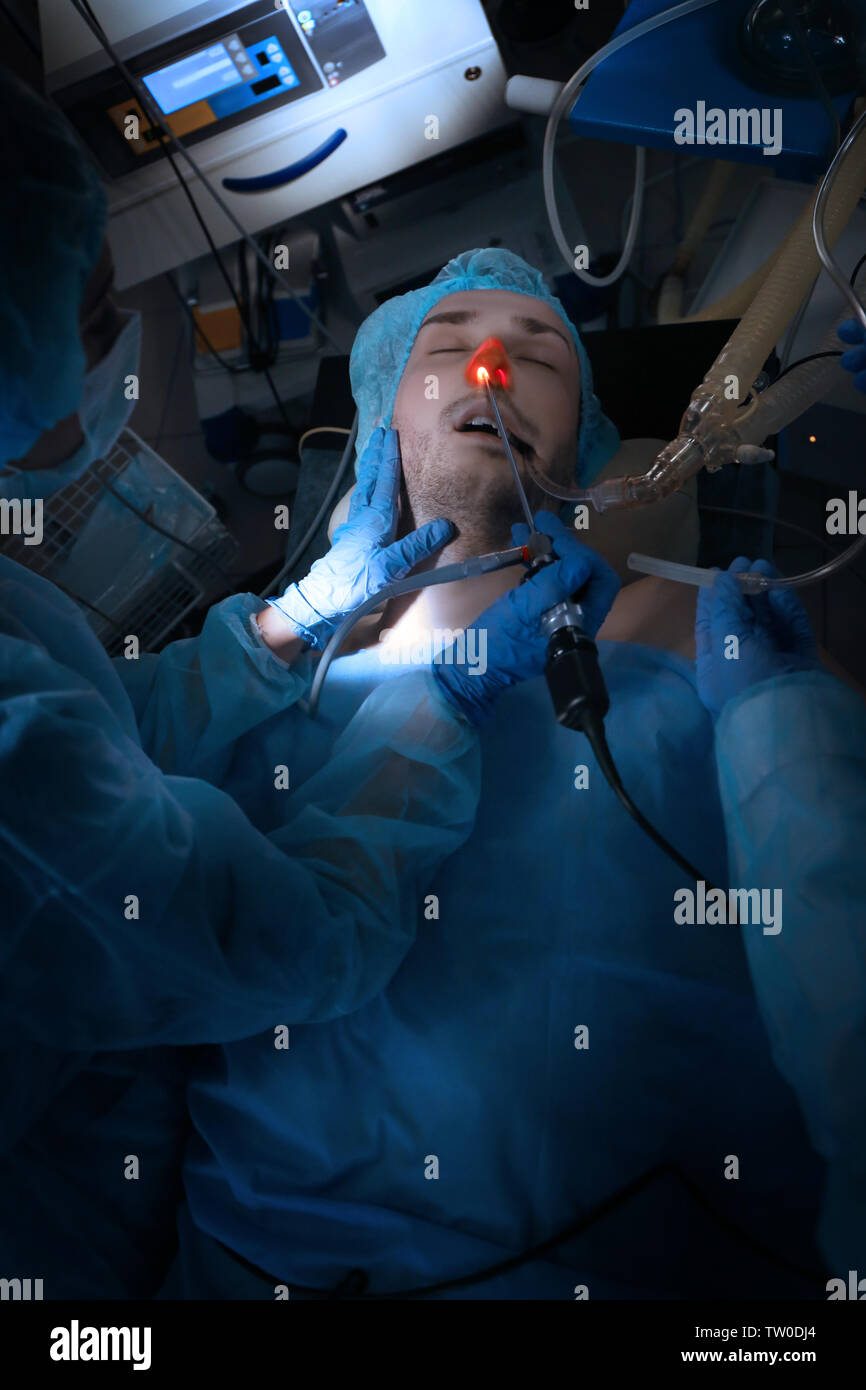 Operating of patient in modern clinic Stock Photo - Alamy