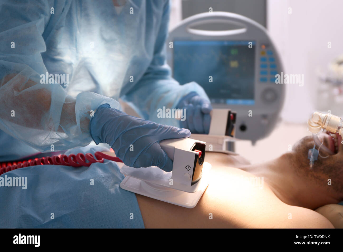 Doctor with patient heart attach hi-res stock photography and images ...