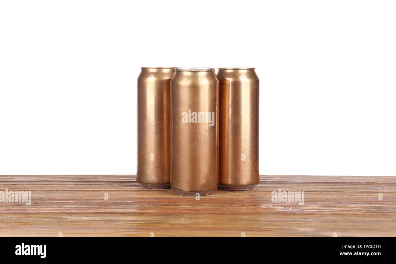 Cans of beer on table against white background Stock Photo - Alamy