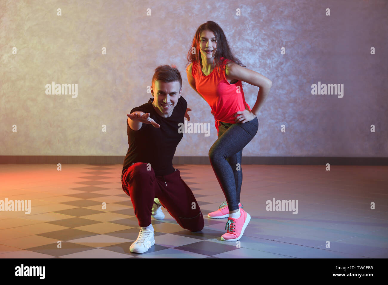 Couple of young hip-hop dancers in studio Stock Photo - Alamy