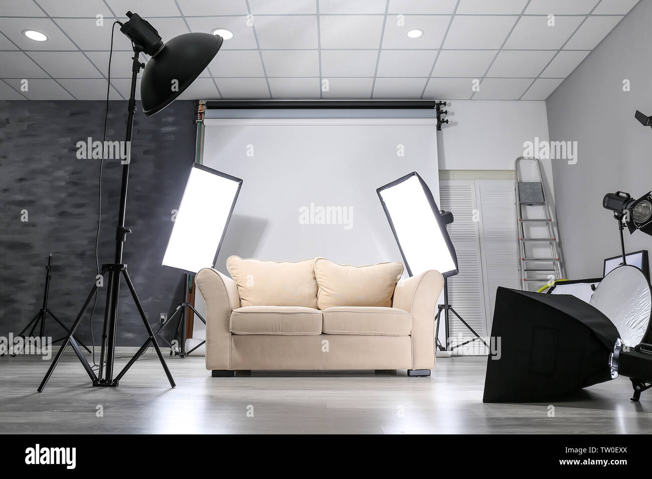 Photo studio with modern interior and lighting equipment Stock Photo ...