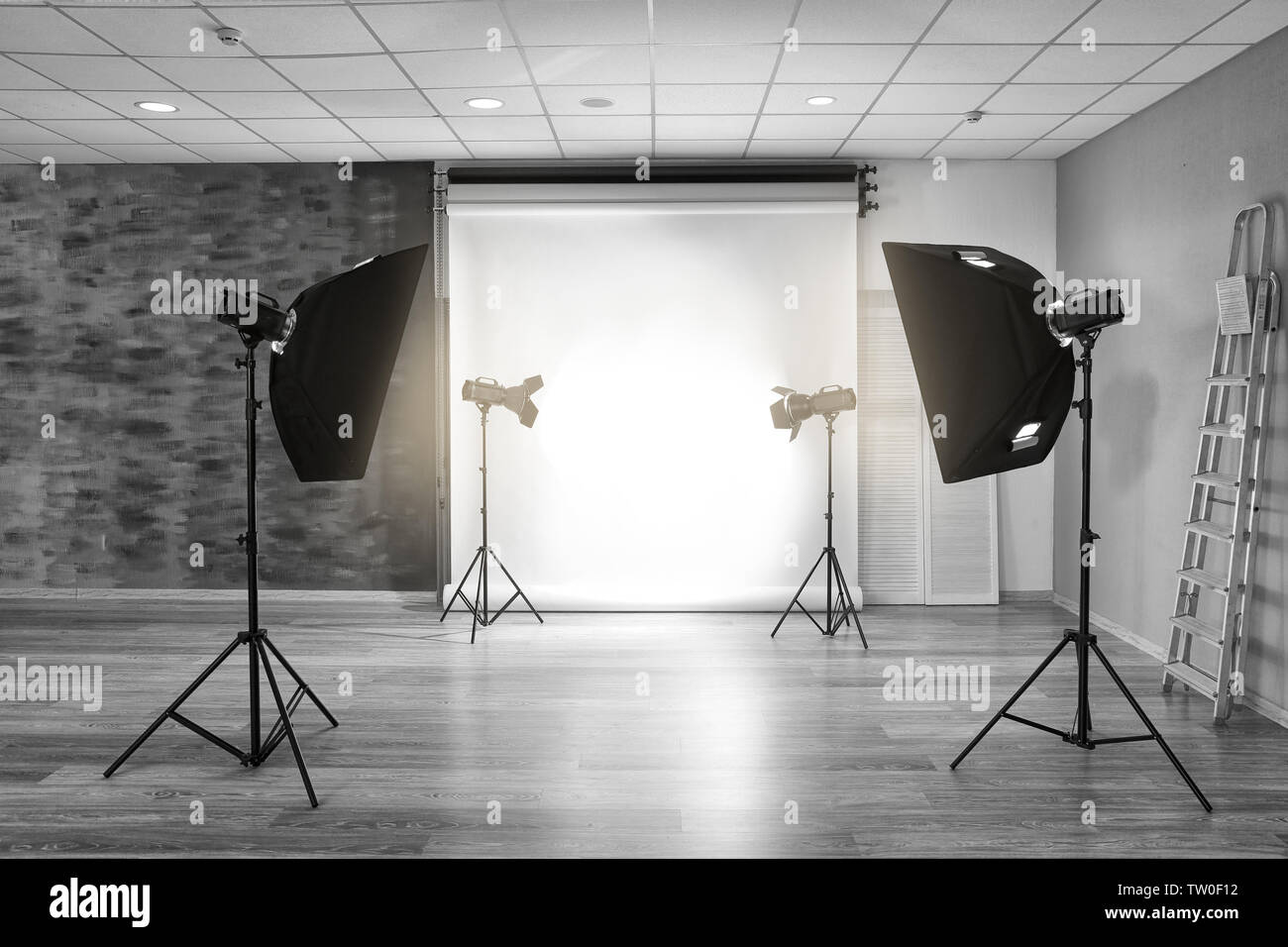 Empty photo studio with lighting equipment Stock Photo - Alamy