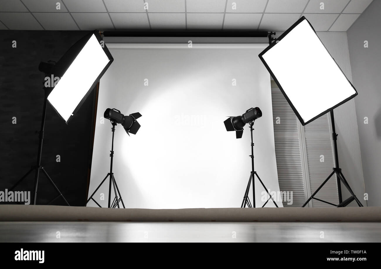 Empty photo studio with lighting equipment Stock Photo - Alamy