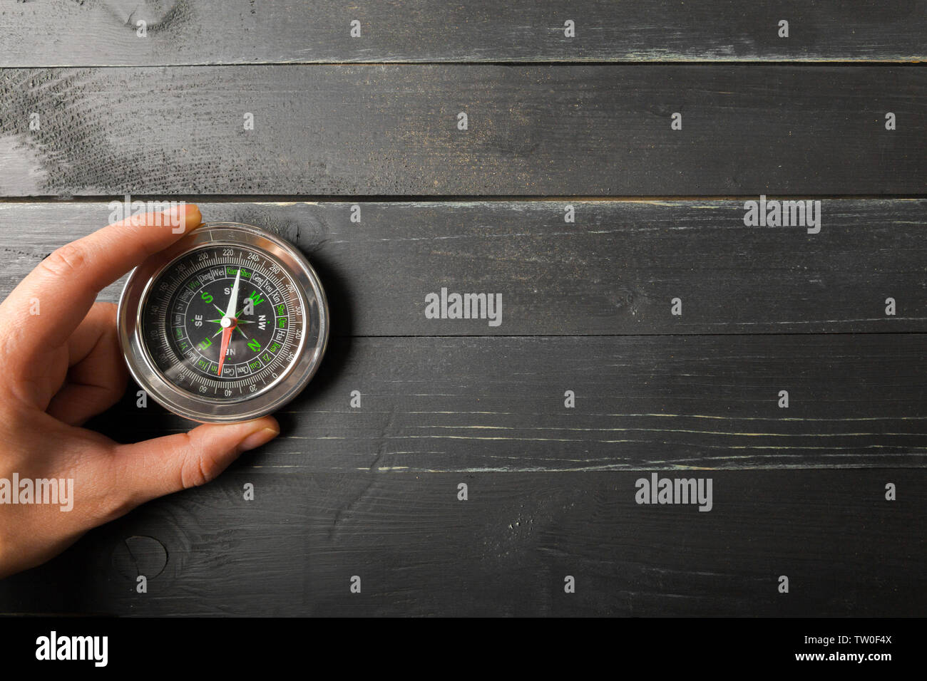 Man Hand Holding Chrome Compass Stock Photo - Alamy