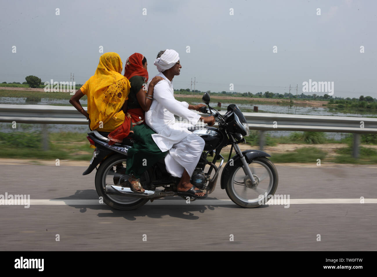 Indian family on bike hi-res stock photography and images - Alamy