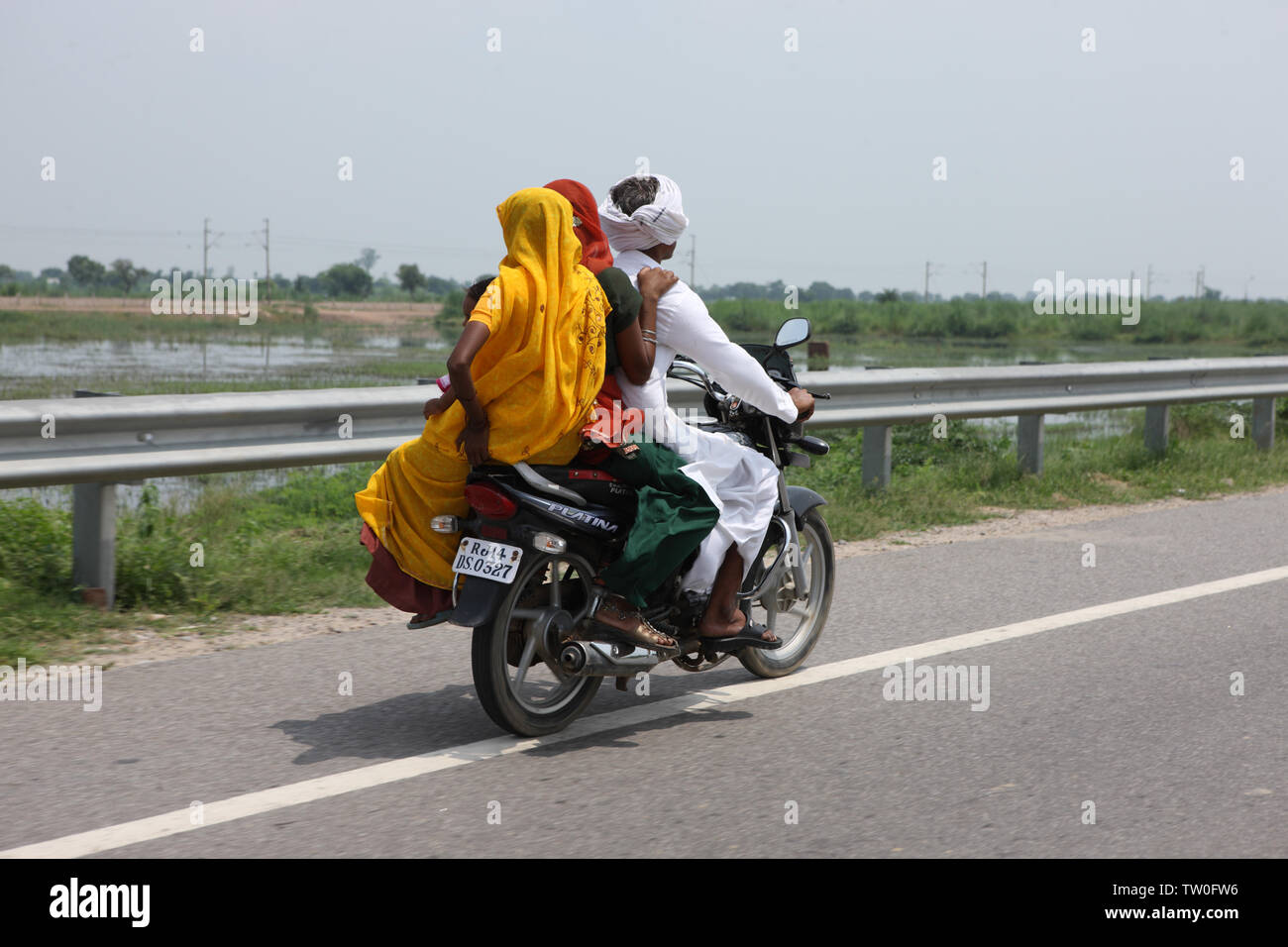 Indian family four on motorcycle hi-res stock photography and images ...