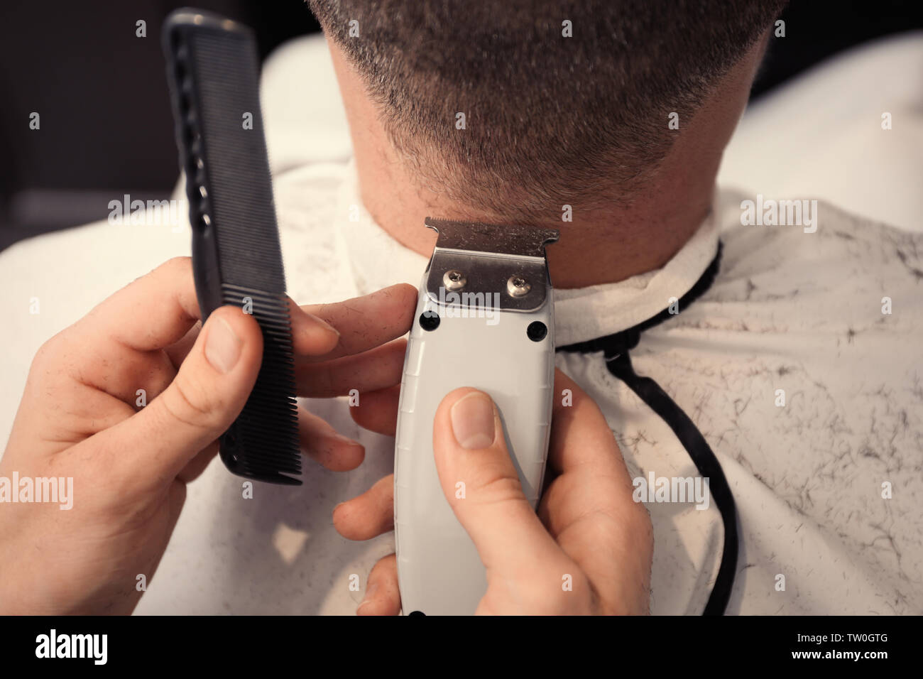 Barber hands cutting hair shaver hi-res stock photography and images ...