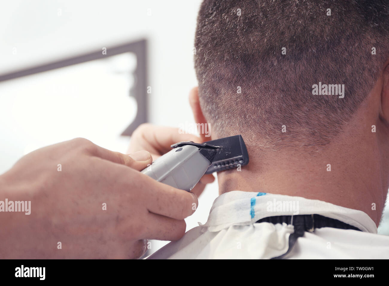 Barber hands cutting hair shaver hi-res stock photography and images ...