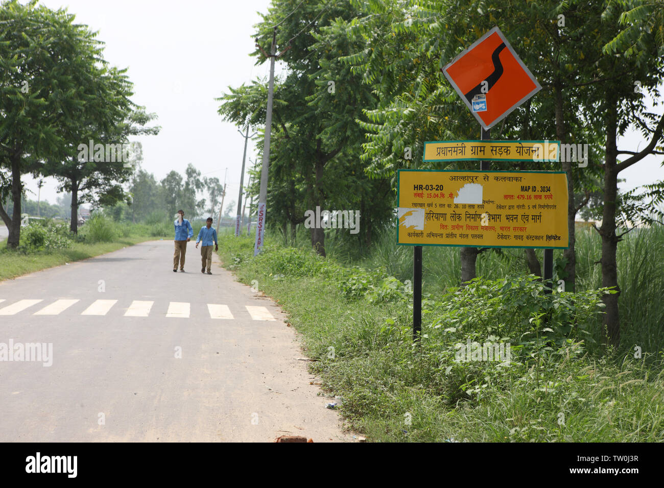 Two Indian schoolboys walking together on the road Stock Photo - Alamy