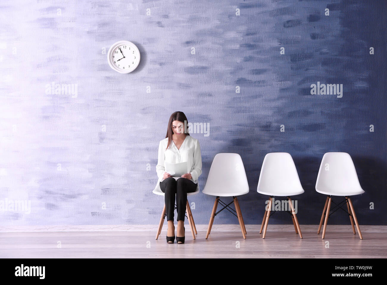 Young woman waiting for job interview in reception hall Stock Photo - Alamy