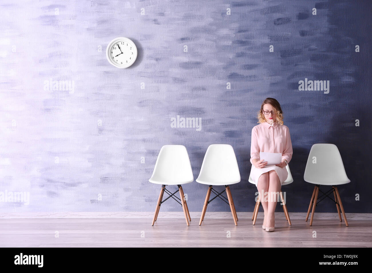 Young woman waiting for job interview in reception hall Stock Photo - Alamy