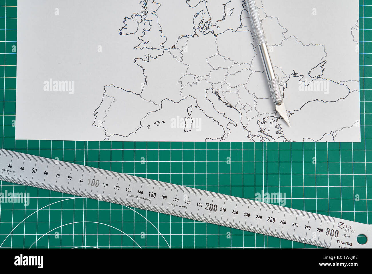 europe map with a ruler and a cutter ready to be divided Stock Photo ...