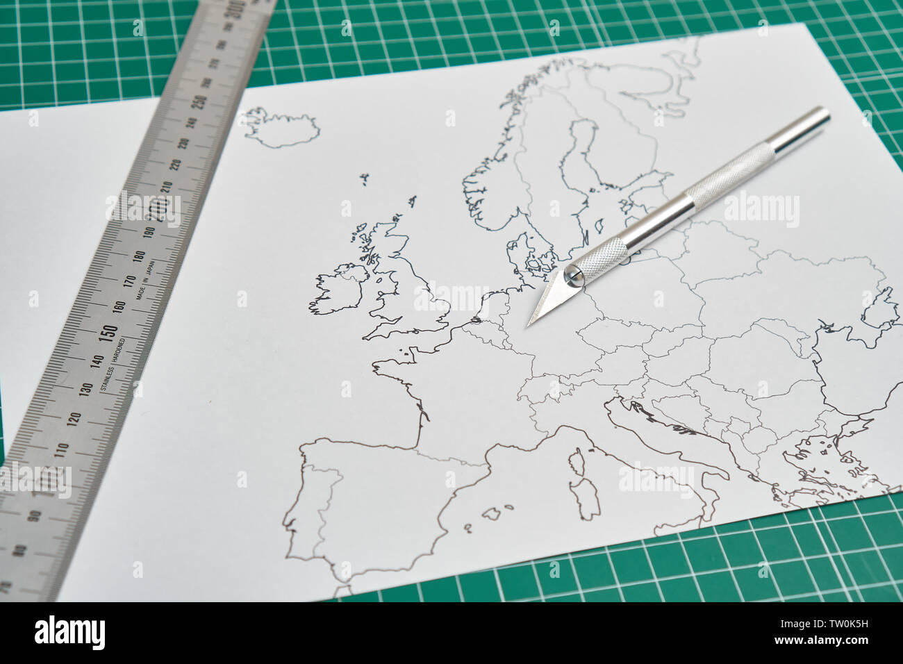 europe map with a ruler and a cutter ready to be divided Stock Photo ...