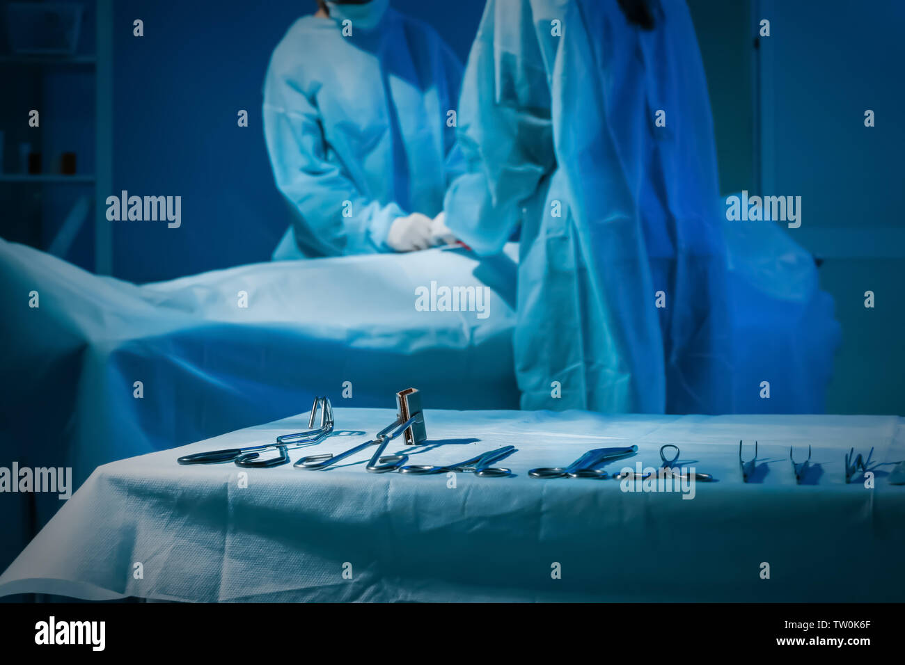 Set of medical instruments on table in operating room Stock Photo - Alamy