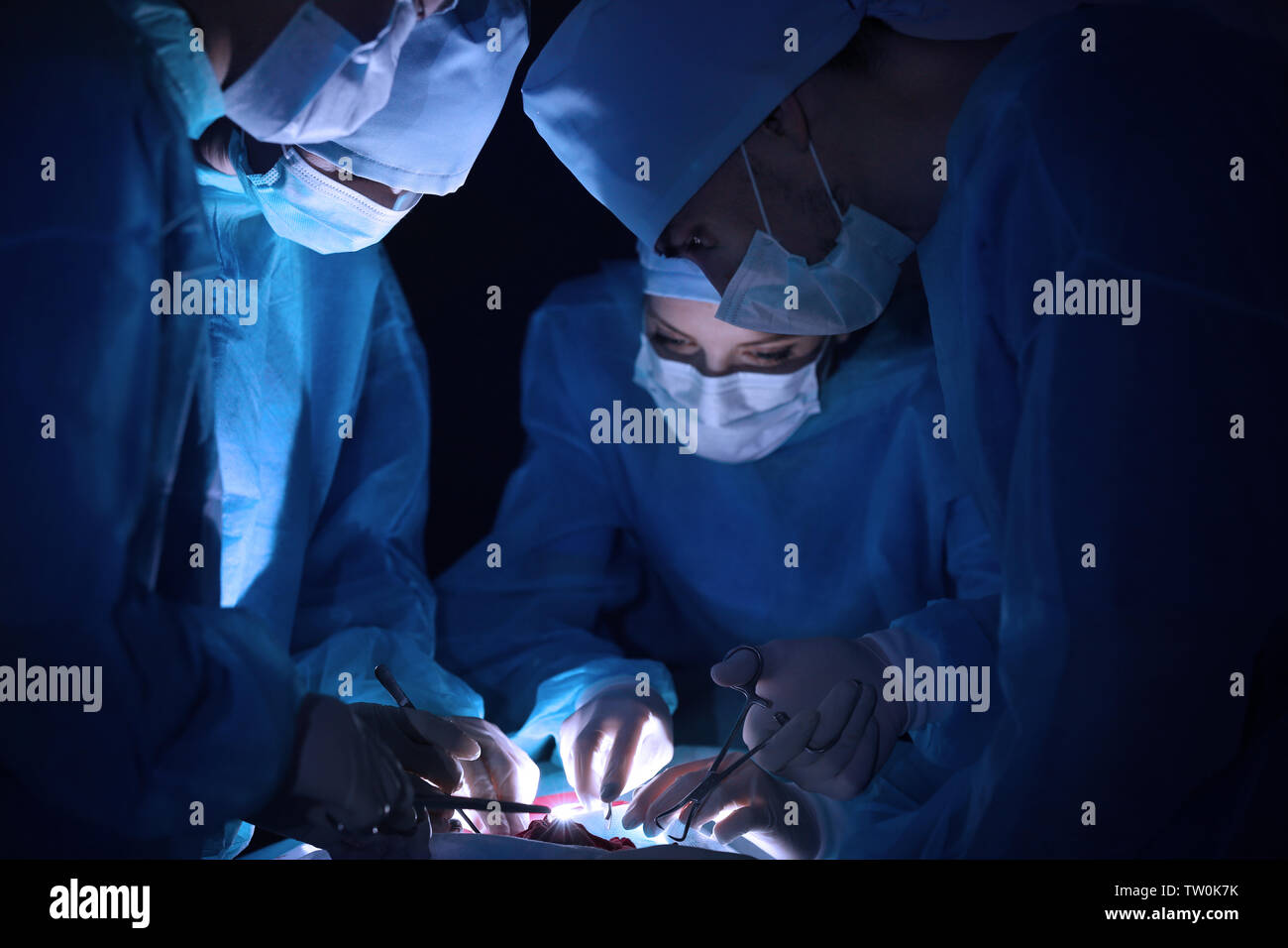 Surgeons operating patient in clinic Stock Photo - Alamy