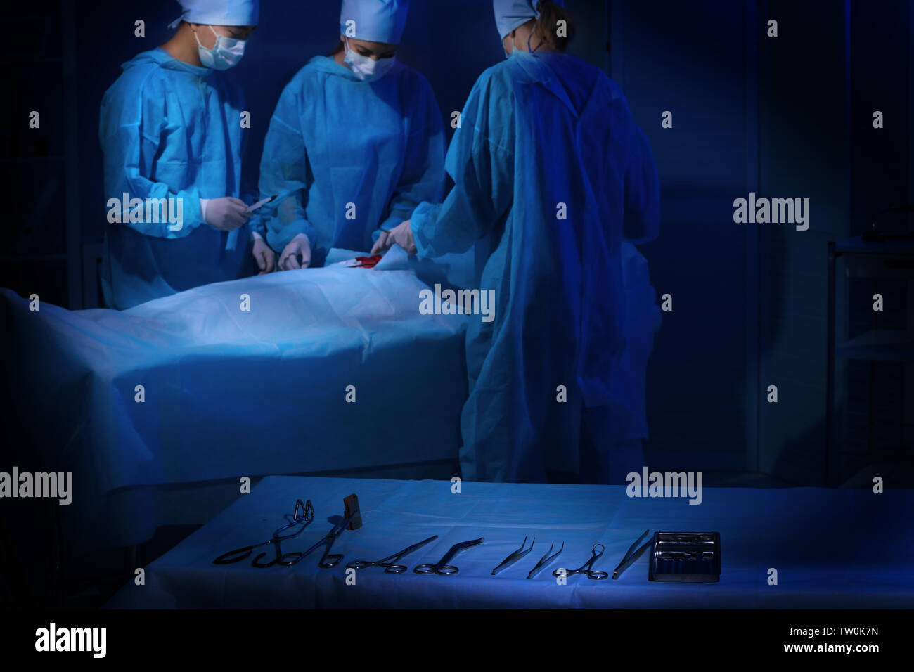 Set of medical instruments on table in operating room Stock Photo - Alamy