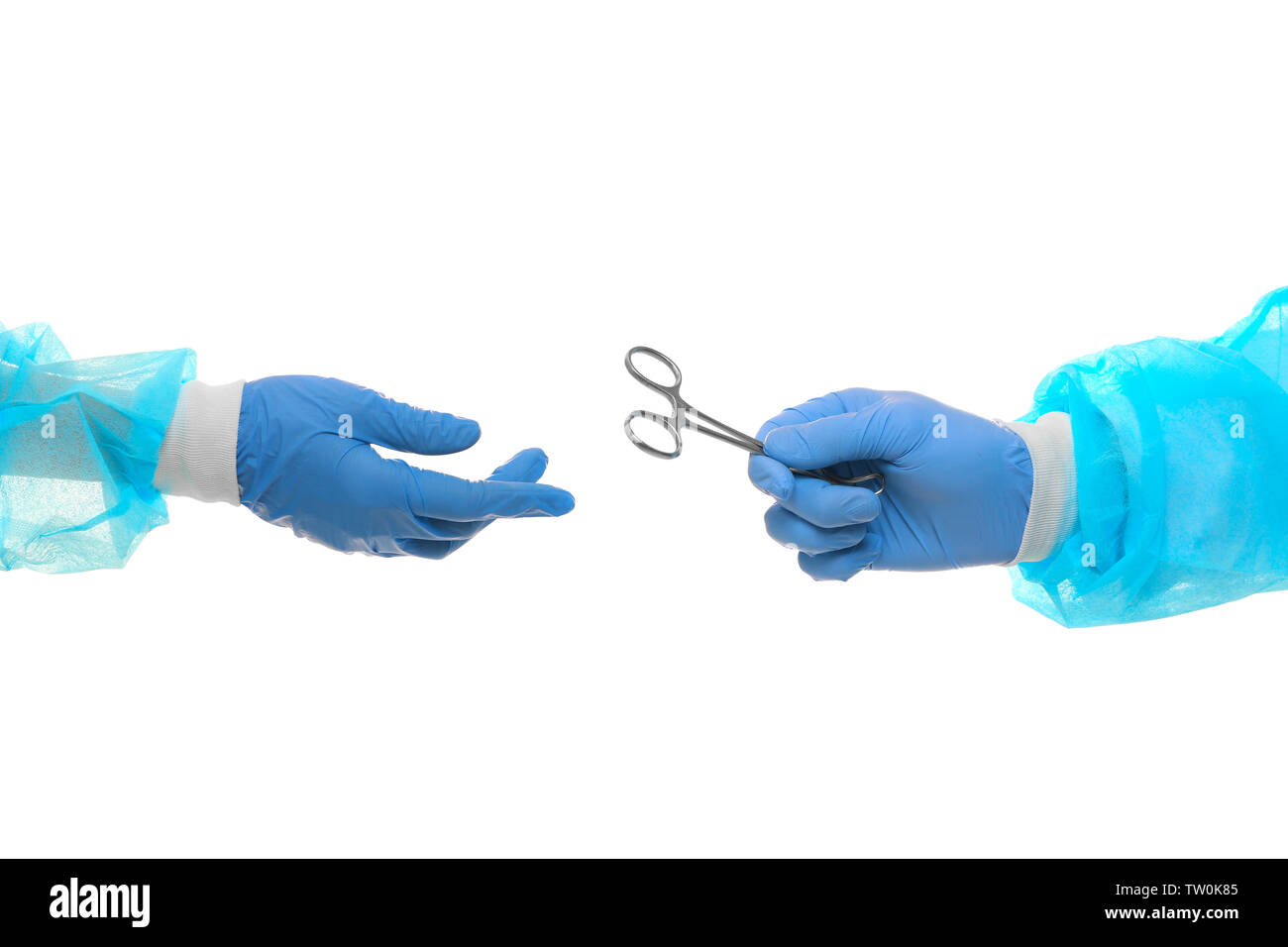 Hands of medical assistant and surgeon with special medical instrument ...