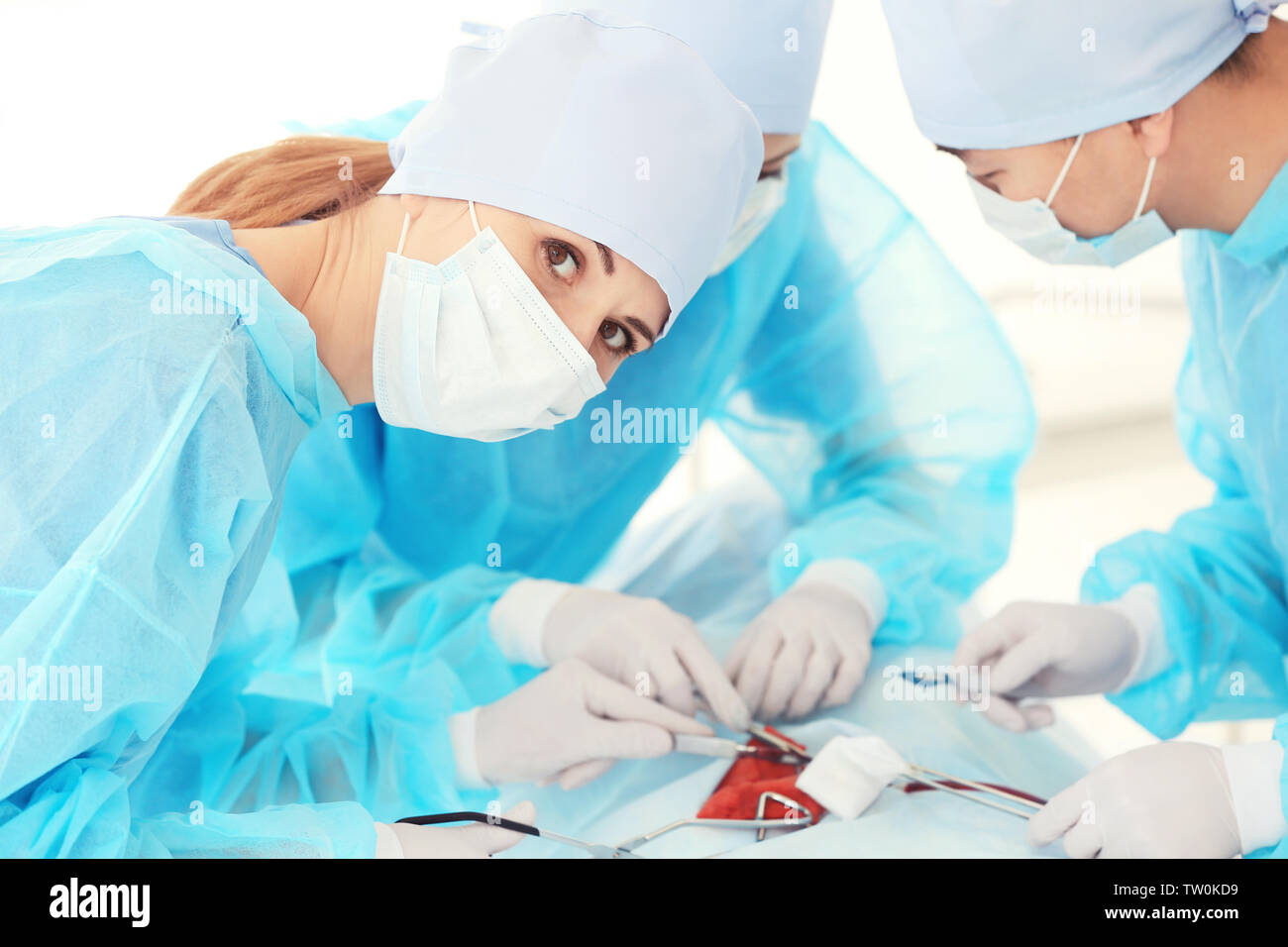 Young doctors operating patient in clinic Stock Photo - Alamy