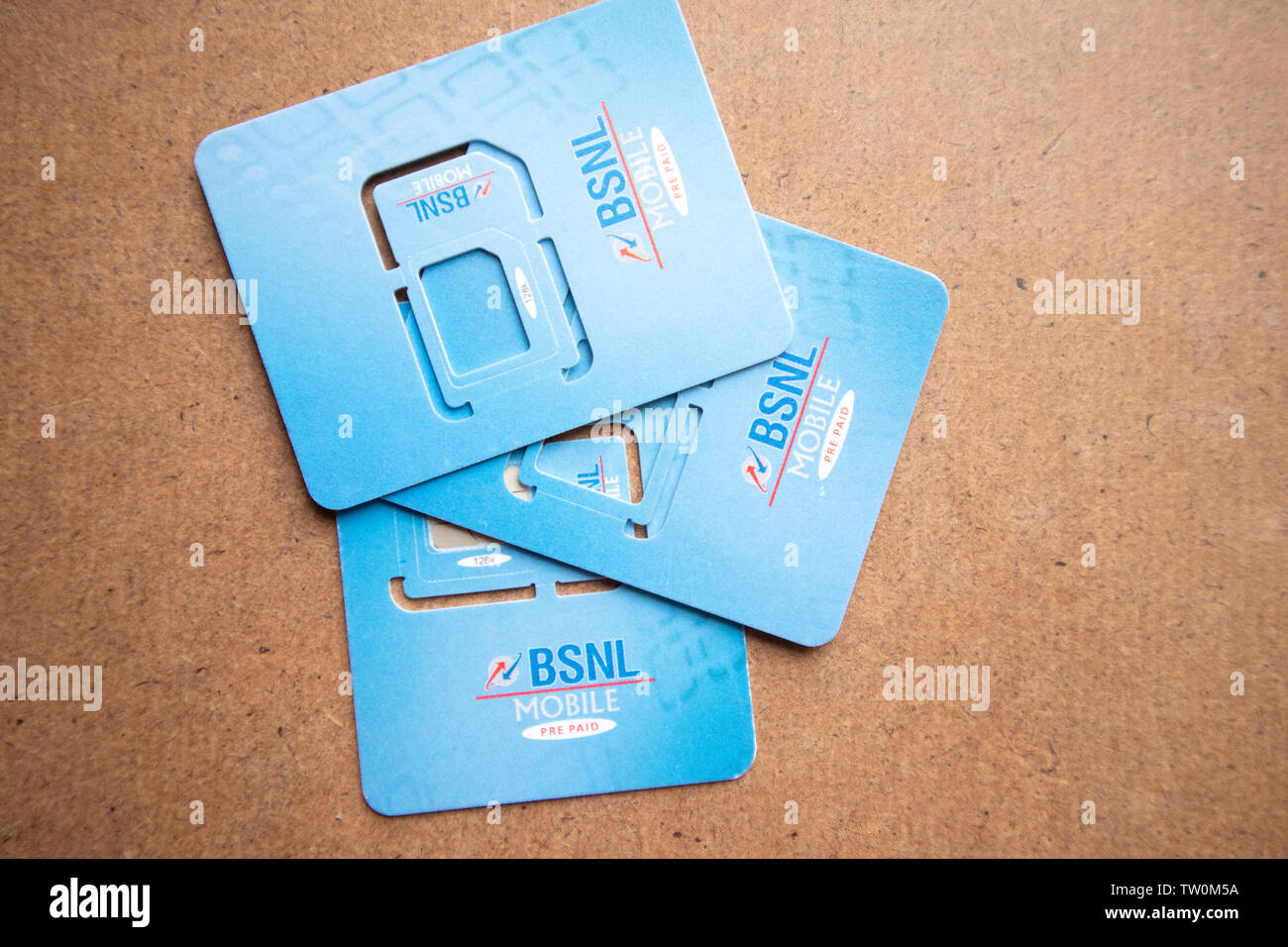 Maski, India - June 18, 2019 :Stack of New BSNL 4G Sim cards on wooden textured table Stock ...