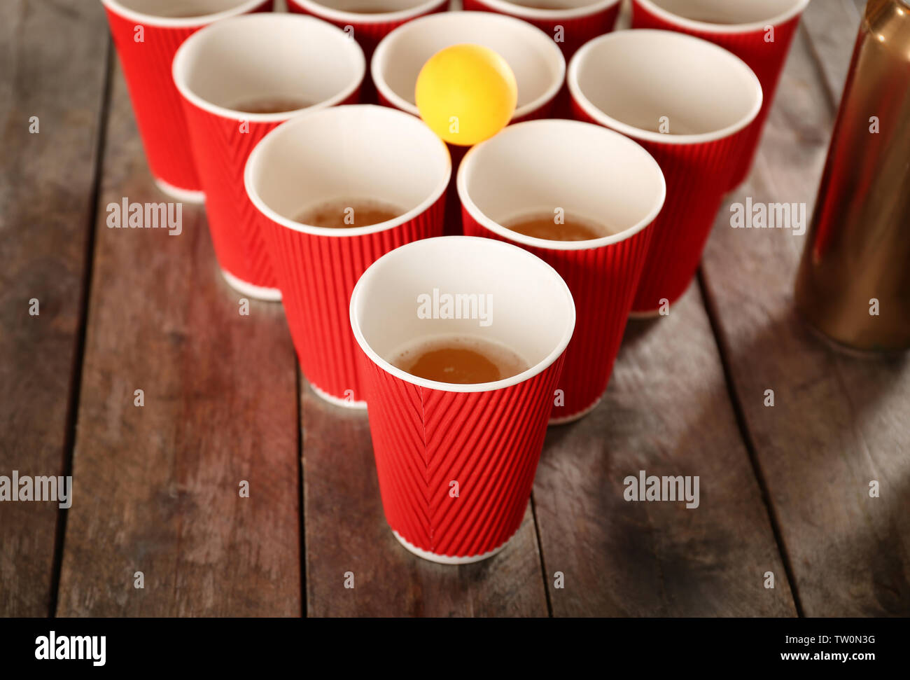 Plastic beer pong cups and ball, closeup Stock Photo - Alamy