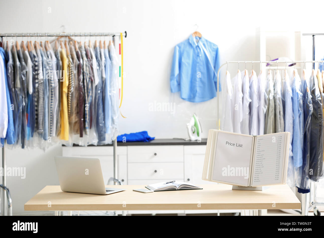 Interior in dry-cleaning salon Stock Photo - Alamy
