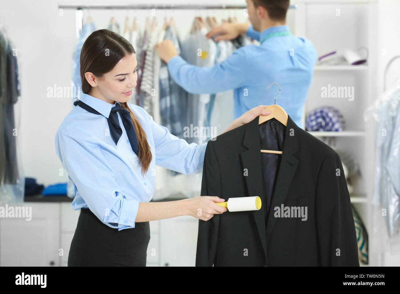 People working in dry-cleaning salon Stock Photo - Alamy