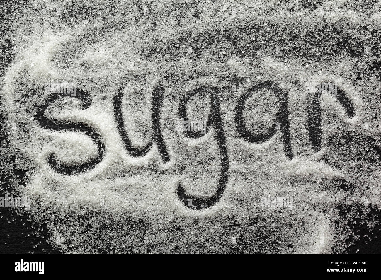 The word sugar written into a pile of white granulated sugar Stock ...