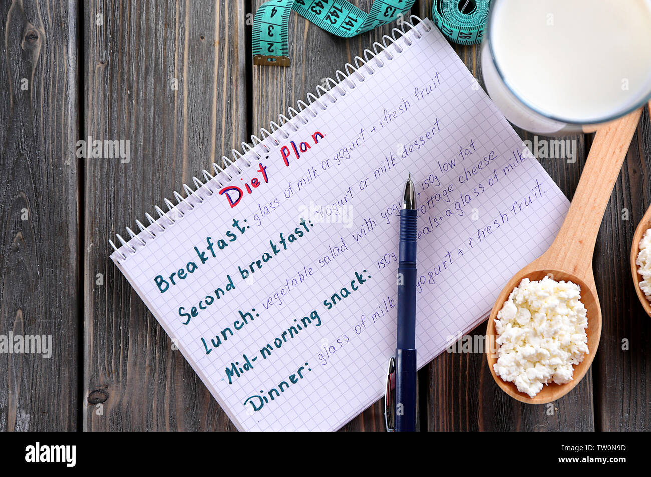 Diary and different dairy products on wooden background Stock Photo - Alamy