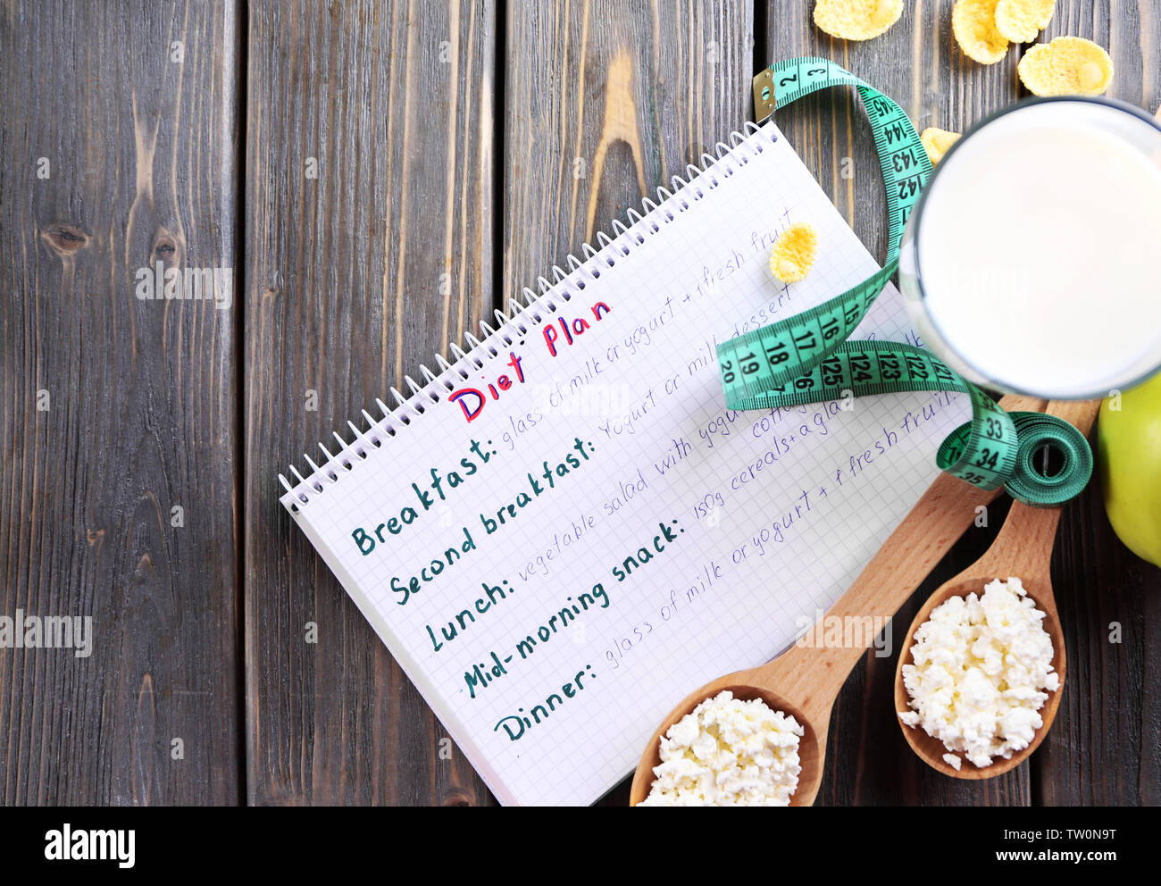 Diary and different dairy products on wooden background Stock Photo - Alamy