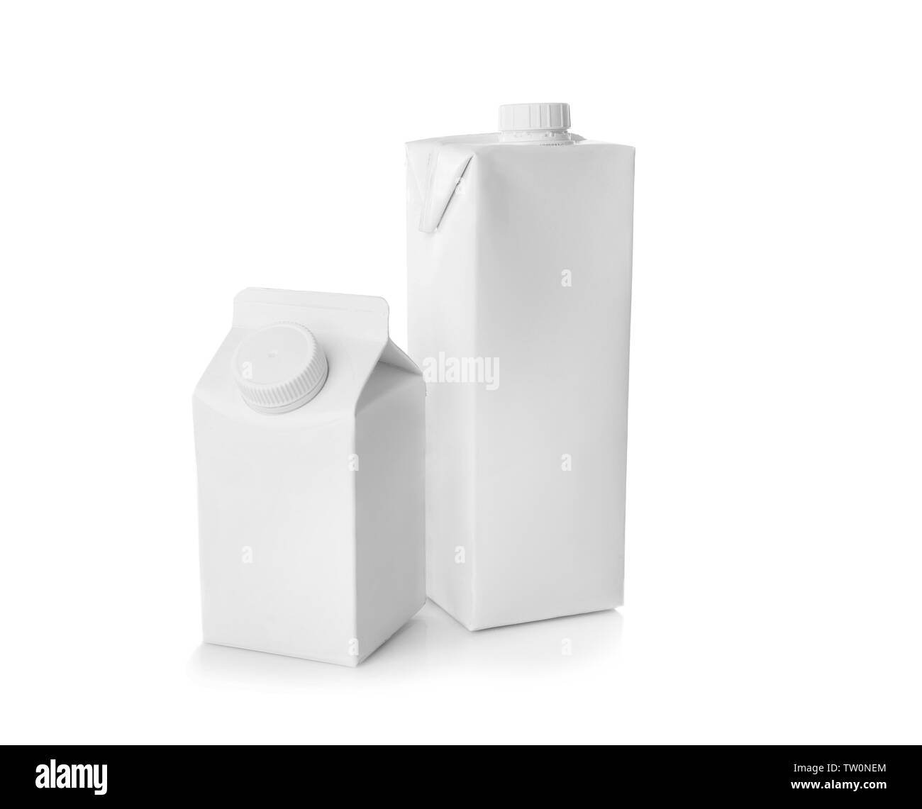 Two simple milk boxes on white background Stock Photo - Alamy