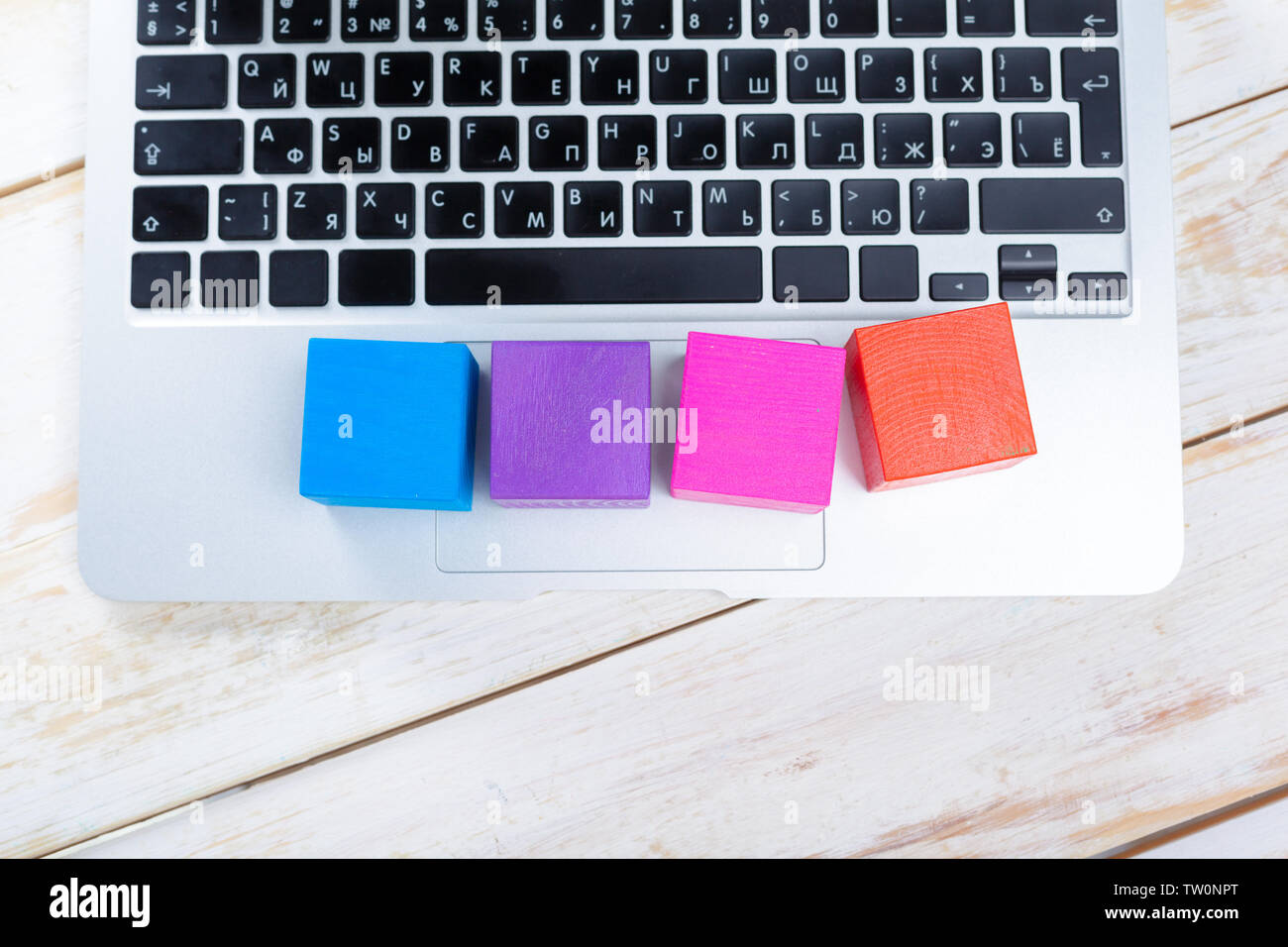 Laptop and wooden cubes Stock Photo - Alamy