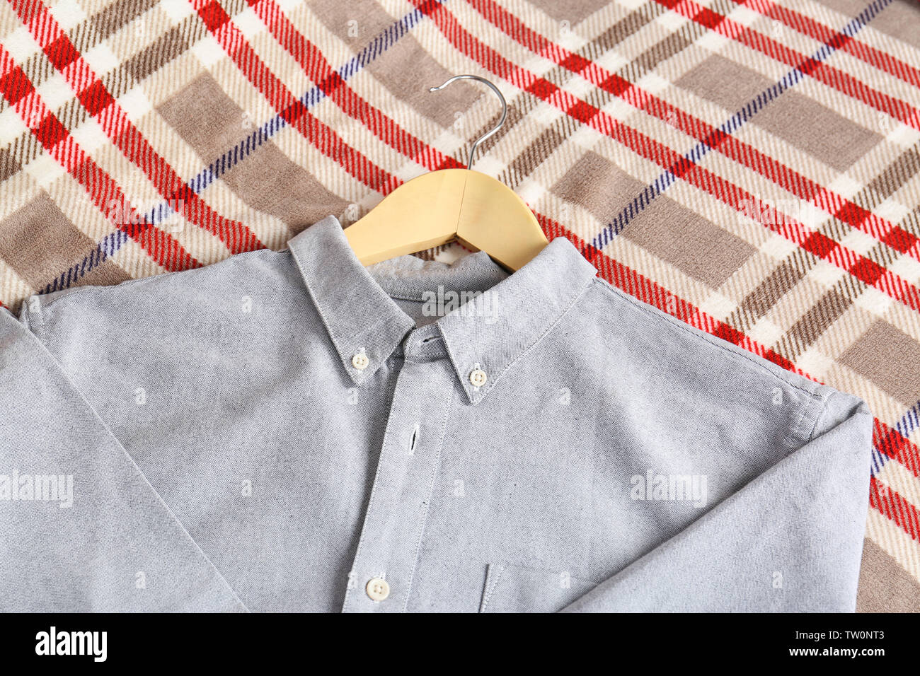 Clean shirt from dry-cleaning on fabric background Stock Photo - Alamy